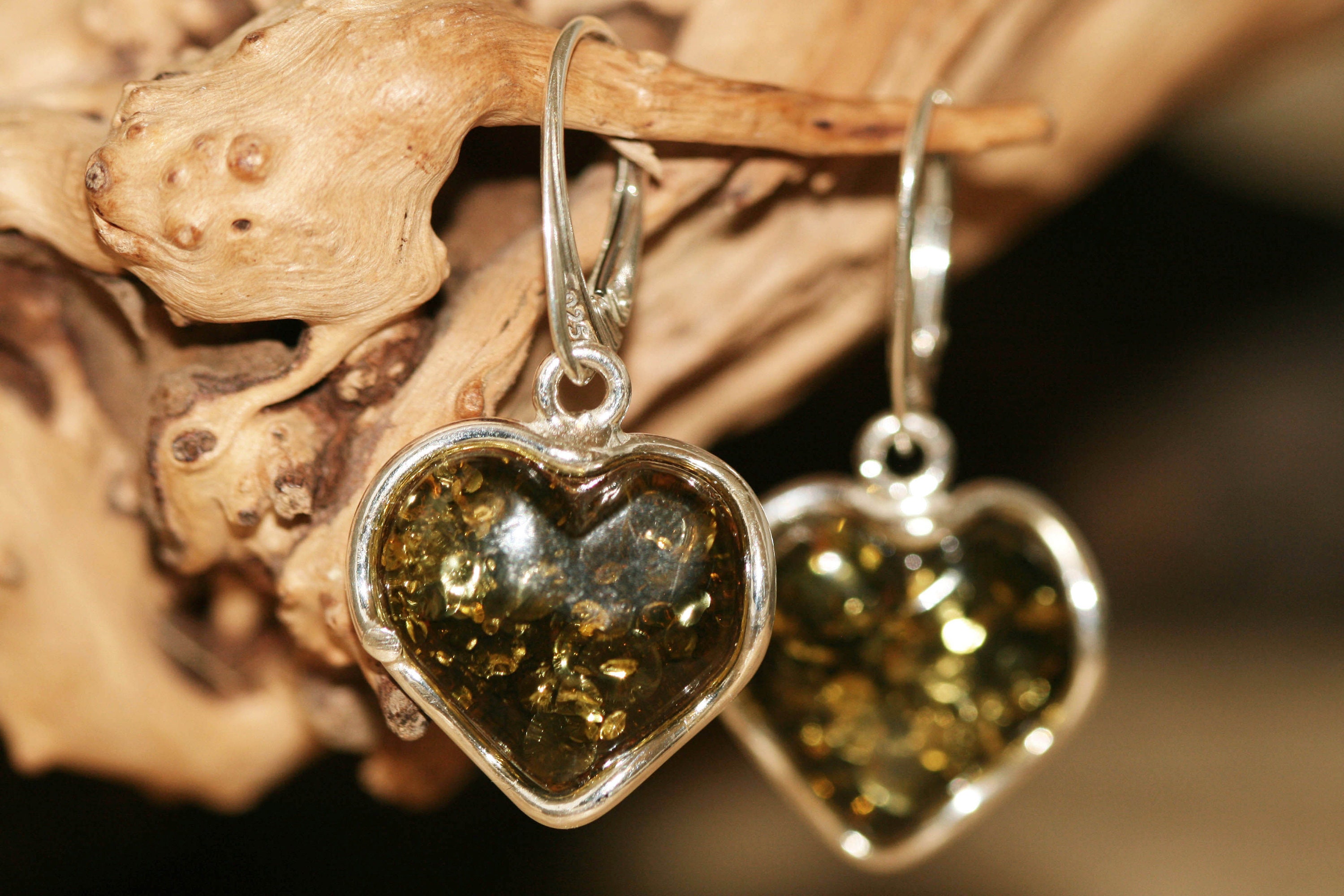 Heart shaped amber earrings fitted in a Sterling Silver setting ...