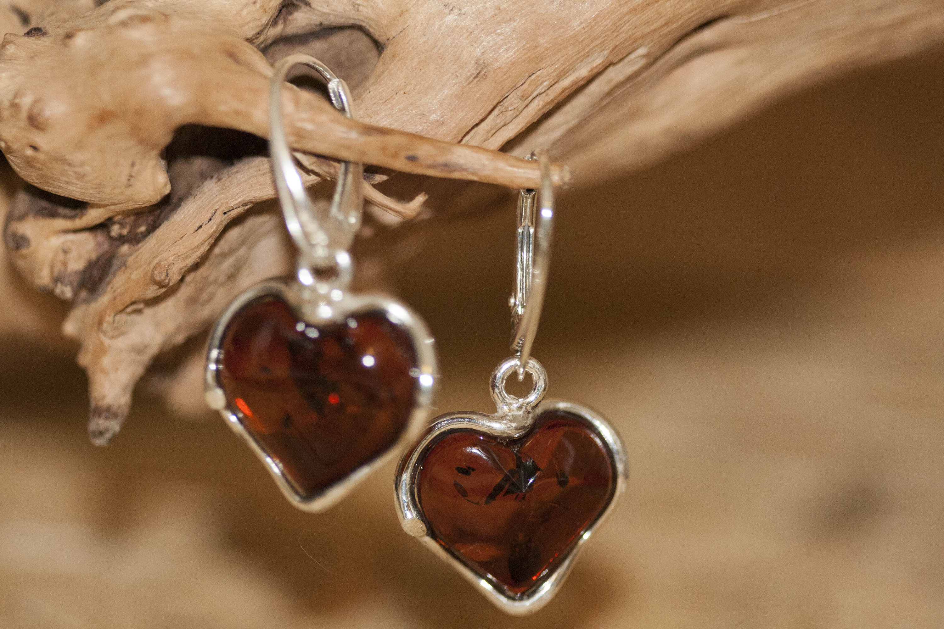 Heart shaped amber earrings fitted in a Sterling Silver setting ...