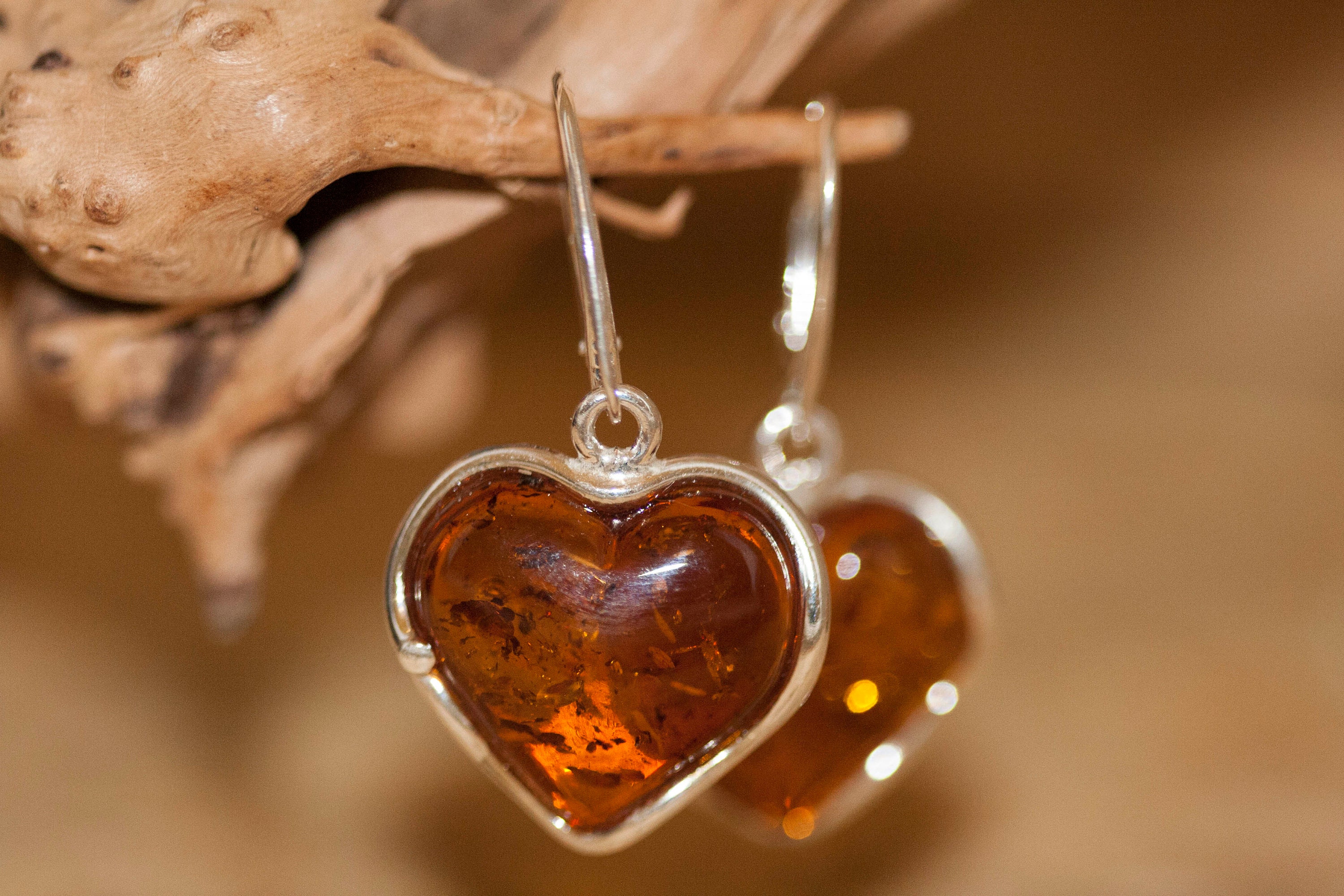 Heart shaped amber earrings fitted in a Sterling Silver setting ...