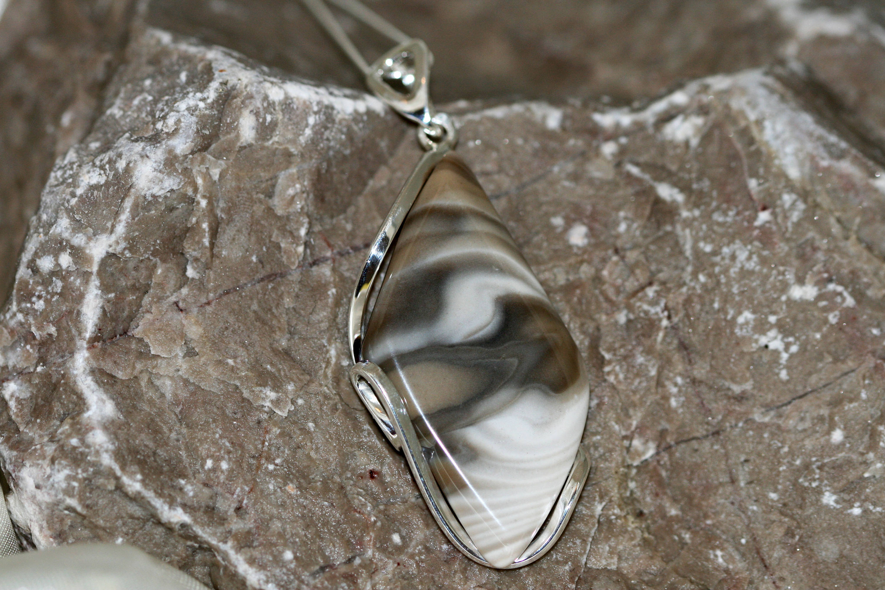 Striped Flint pendant fitted in sterling silver setting.