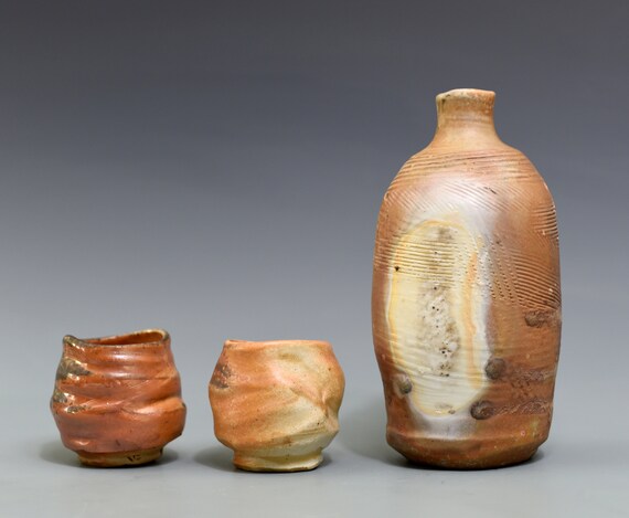Wood fired Japanese sake set. Round bottle and 2 matching | Etsy