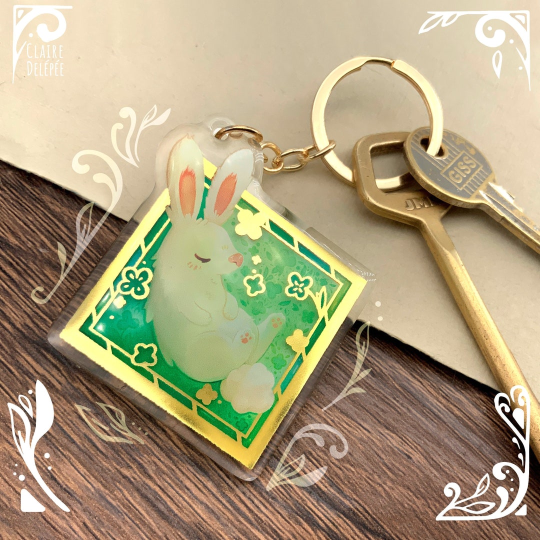 Cute Rabbit Keychain : a Sleeping Bunny in a Gold Frame, With Clovers ...