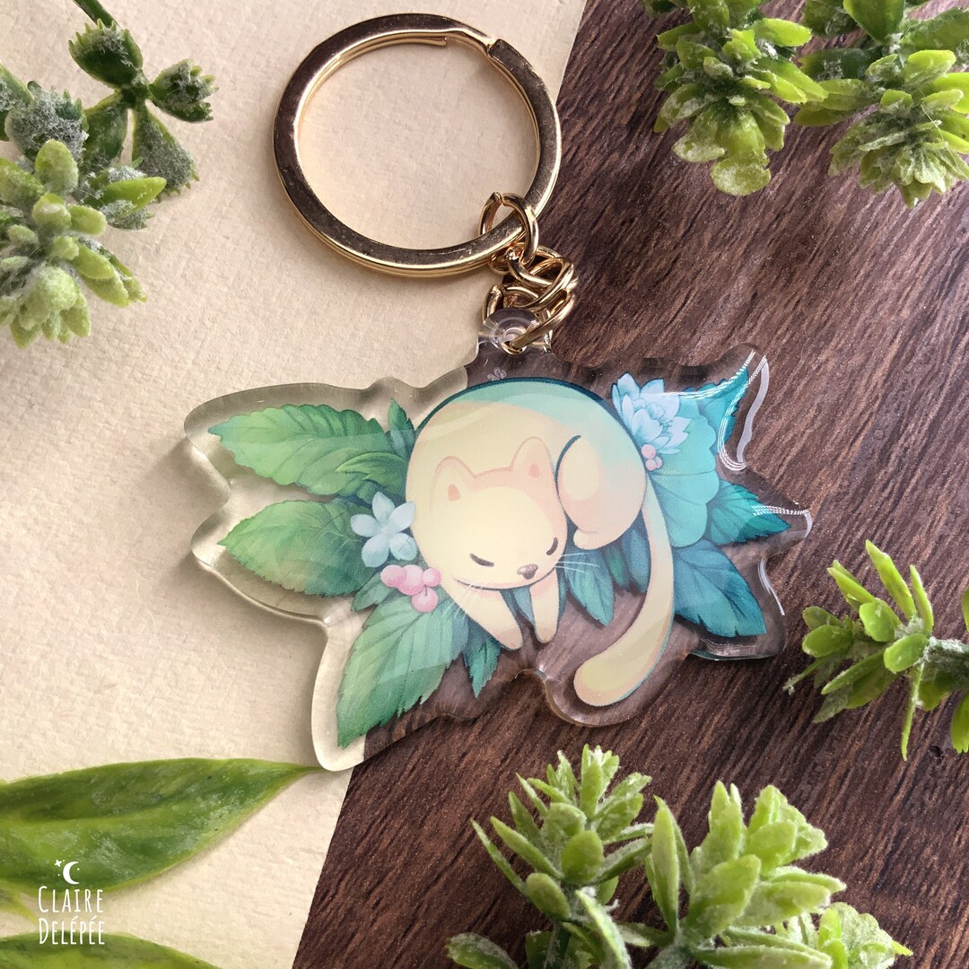 Cute Cat Keychain : a Small Kitten Sleeping in a Cosy Nest of Plants ...