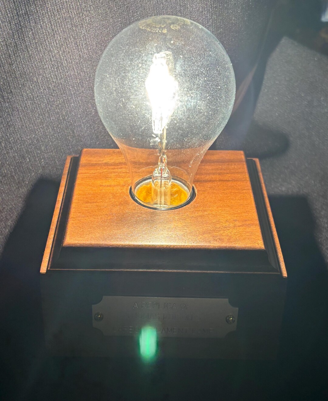 Replica of Thomas Edison Carbon Filament Bulb on Wooden Base Lights Up ...