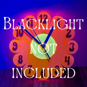 Mini Blacklight Retro Daisy Wall Clock - Funky Wall Clock - Glow in the ...