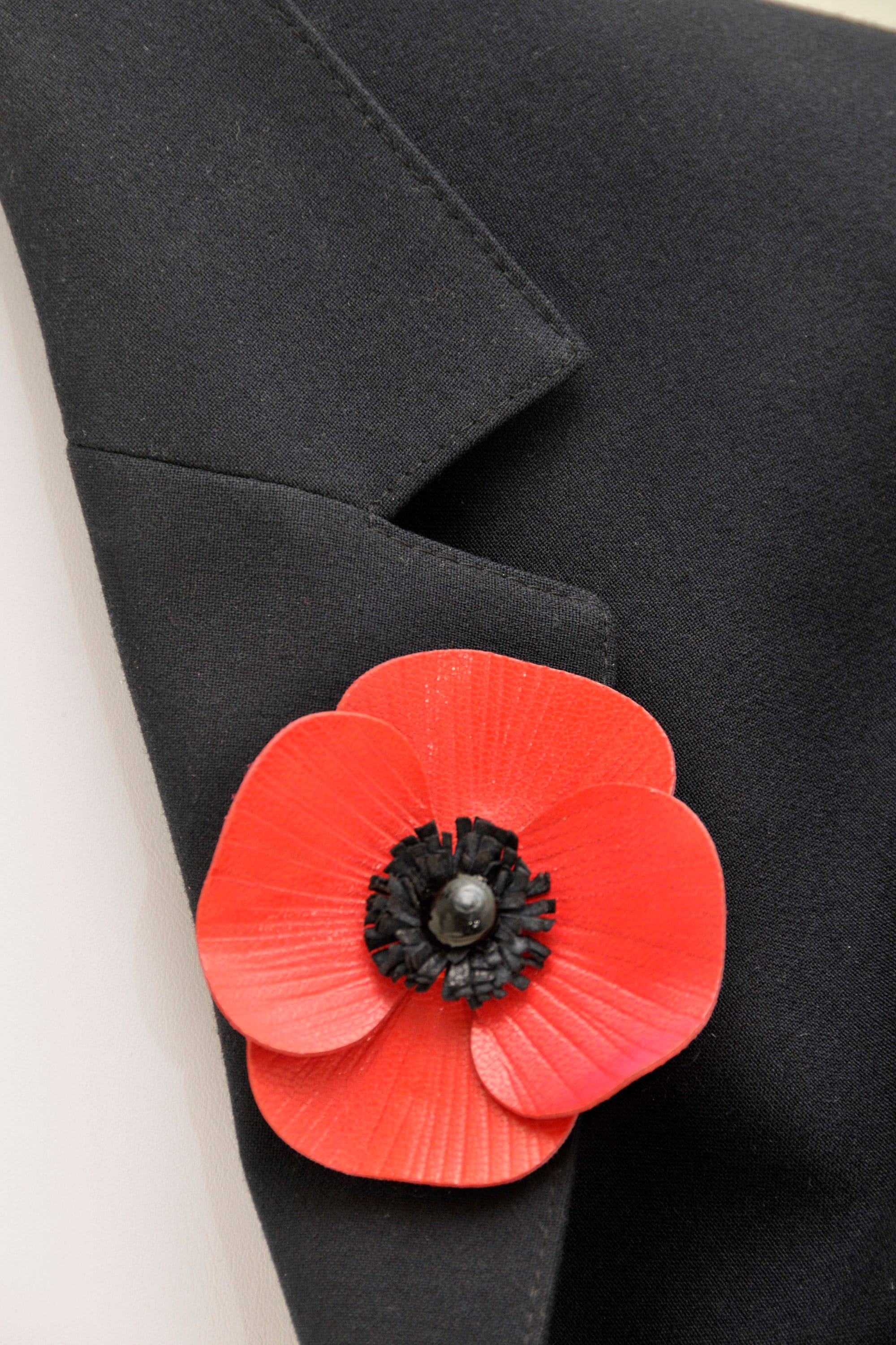 Leather poppy brooch with glass pearl
