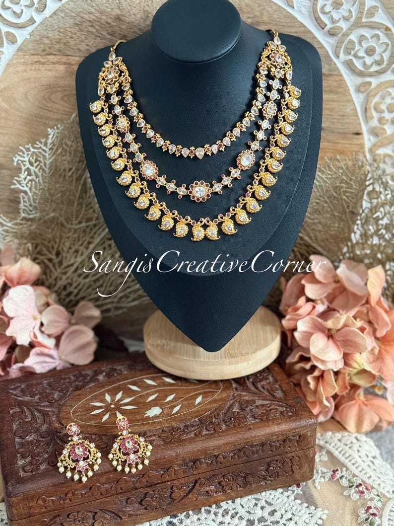 AD Stone Multi Layer Jewelry Set: Gold Plated Necklace and Dangling ...