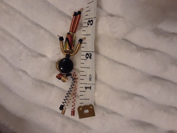 Unusual metal man movable pin - Gem