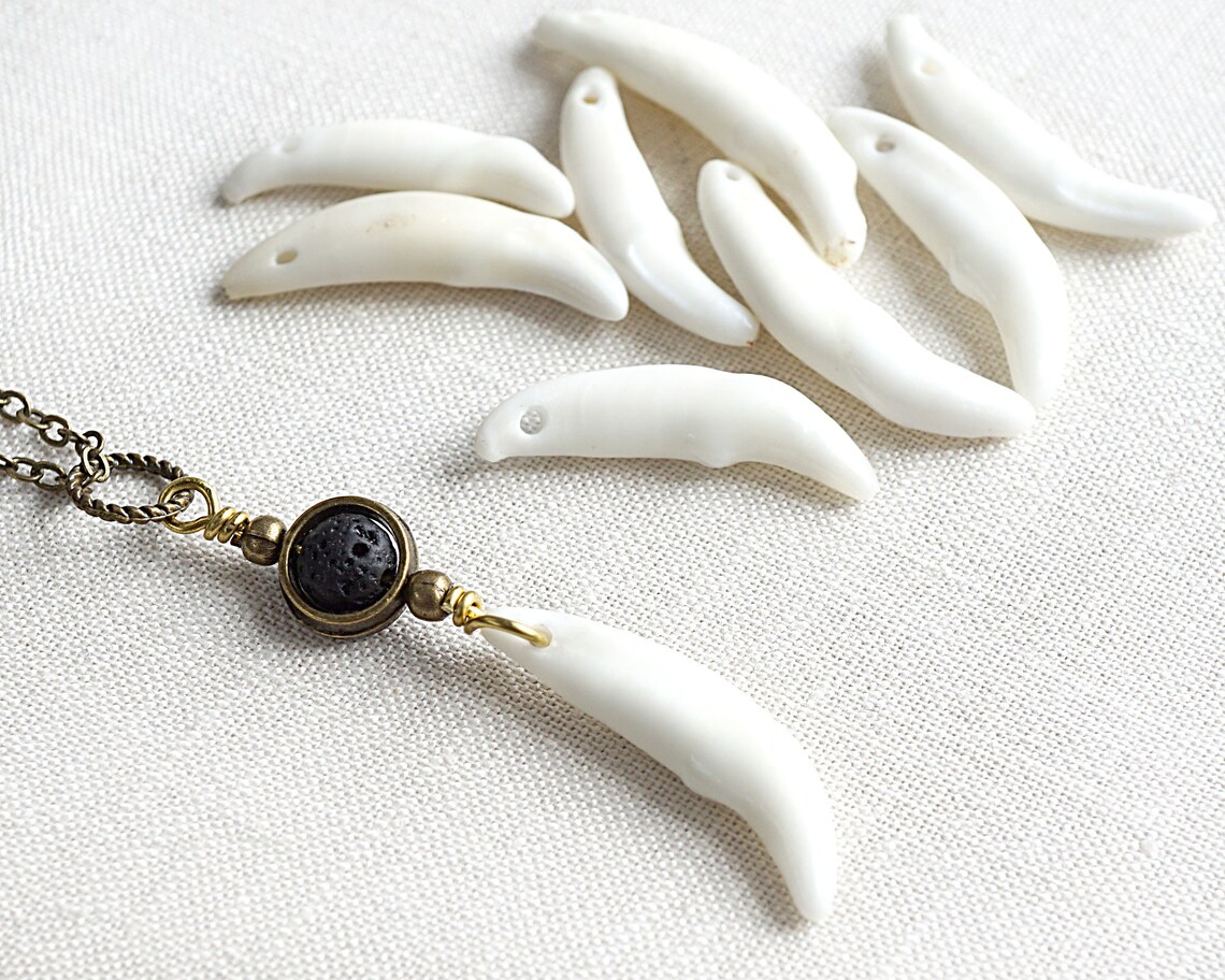 ON VACATION, Dainty Wolf Tooth Necklace Wolf Necklace Black Lava Raw ...