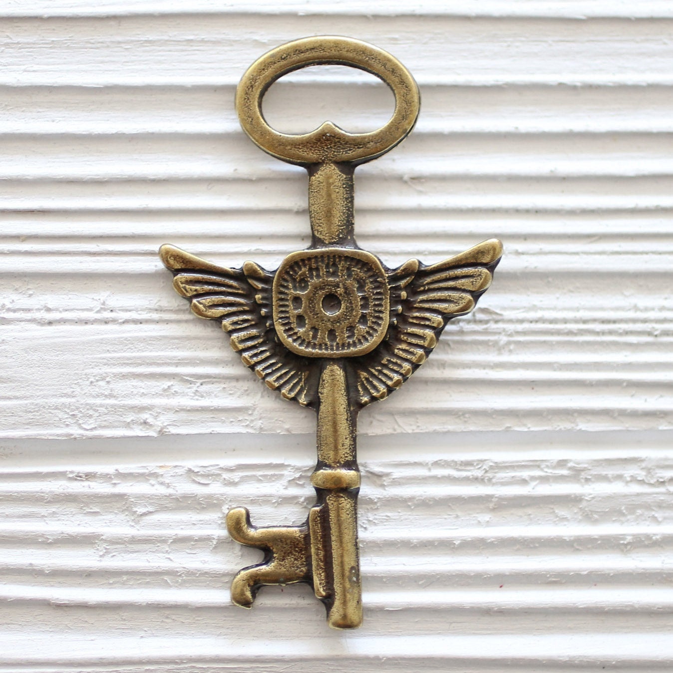 Key pendant, angle wings, antique gold key, key medallion, rustic key ...