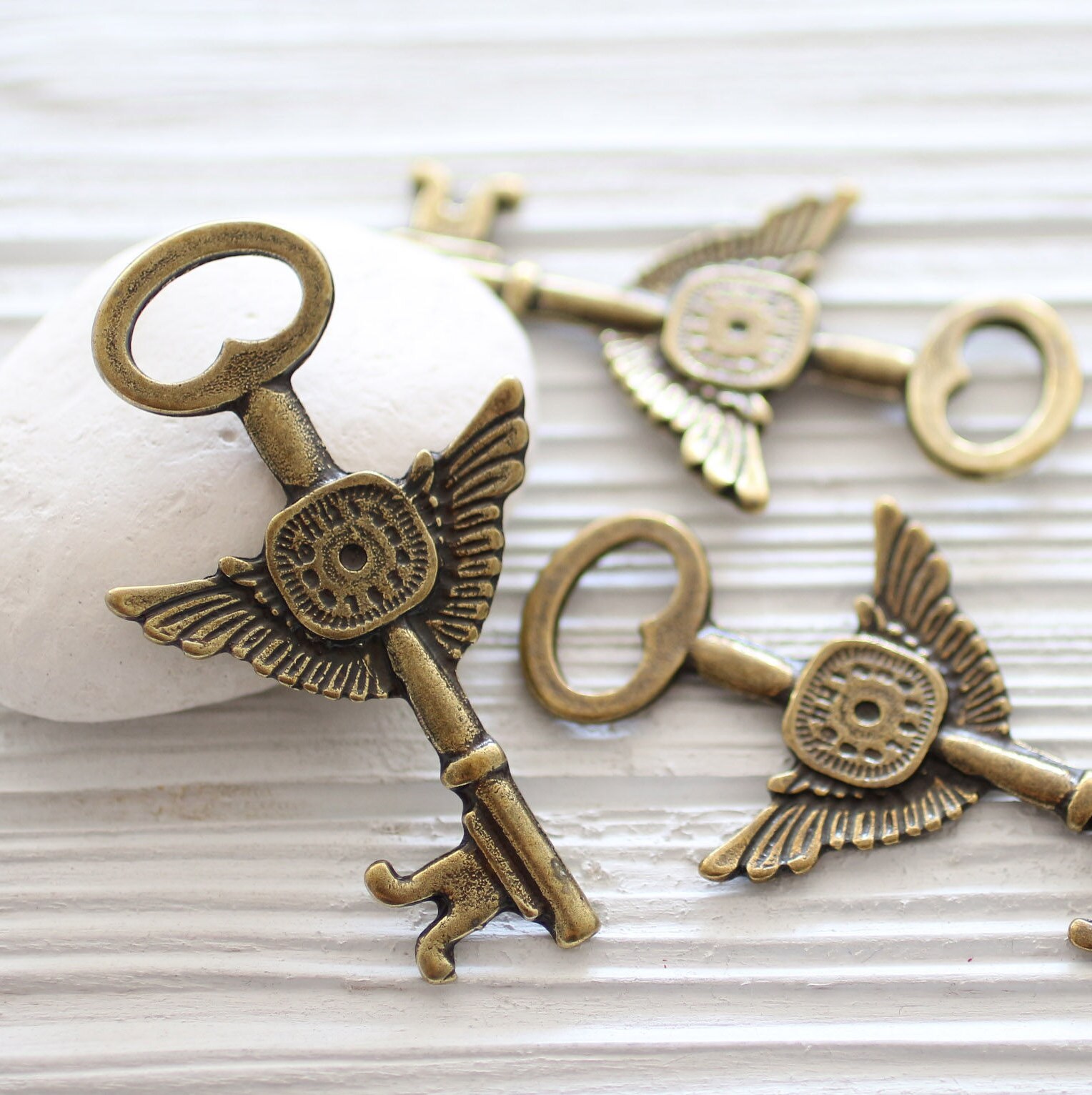 Key pendant, angle wings, antique gold key, key medallion, rustic key ...