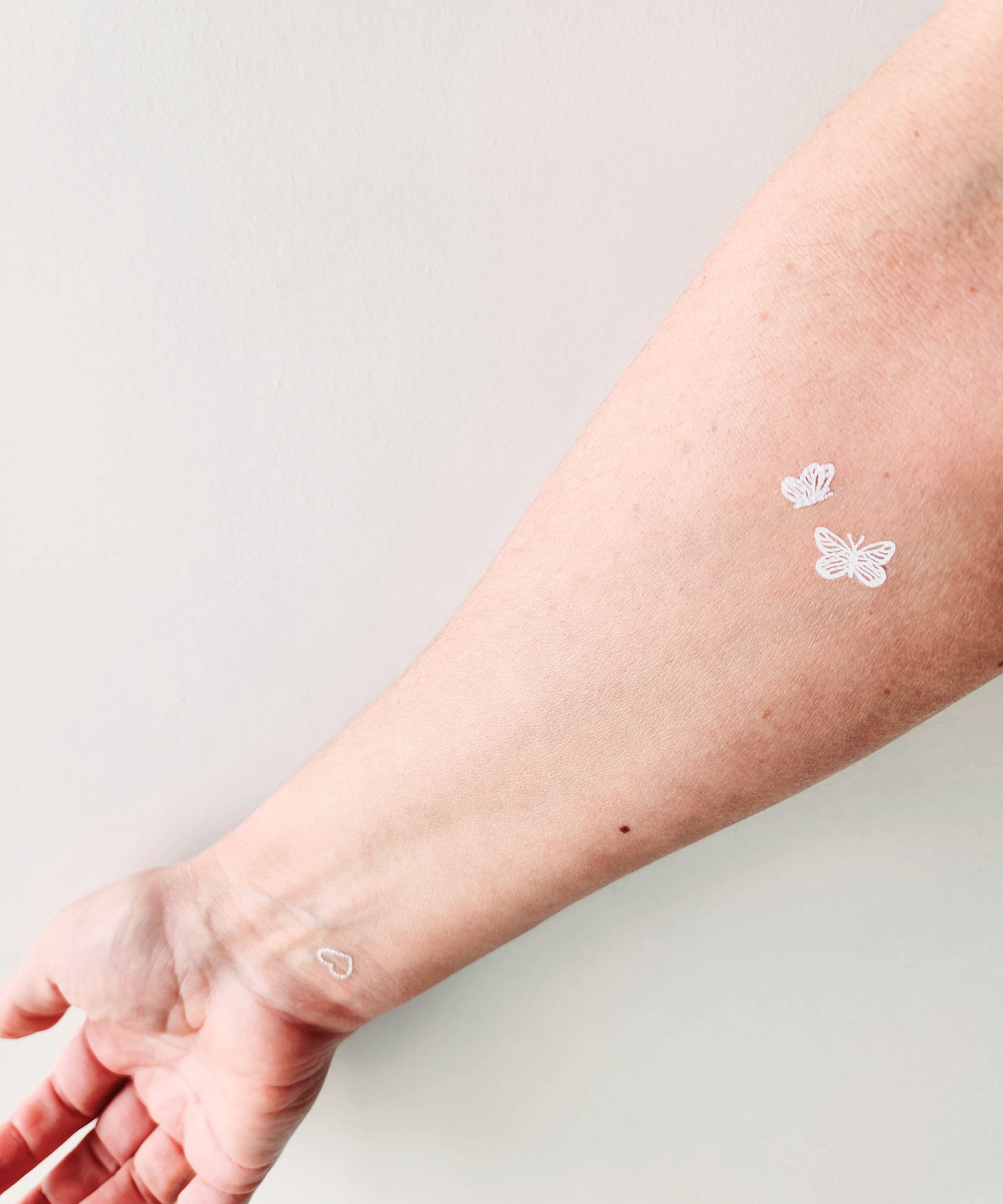 White Ink Butterfly Tattoo