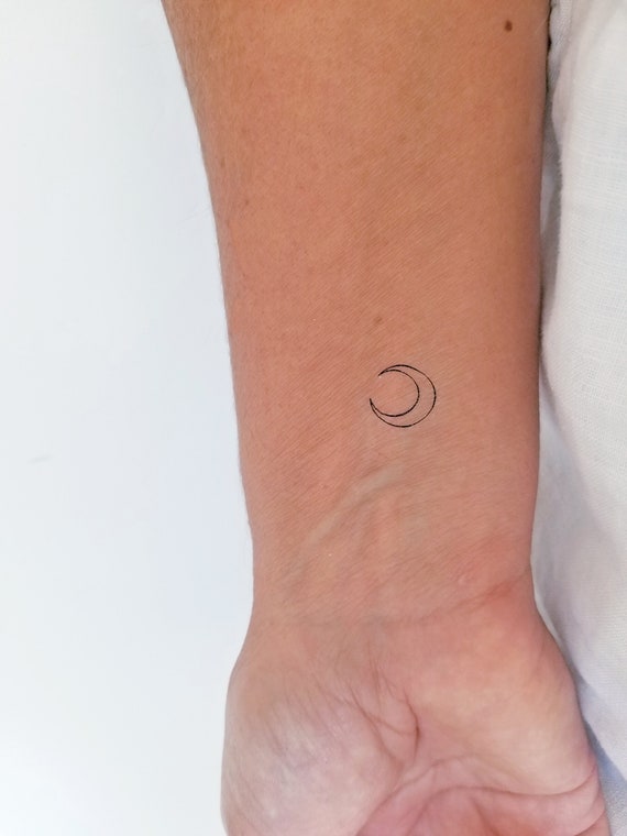 Crescent Moon Outline Tattoo