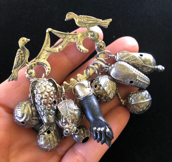 Traditional silver charms store