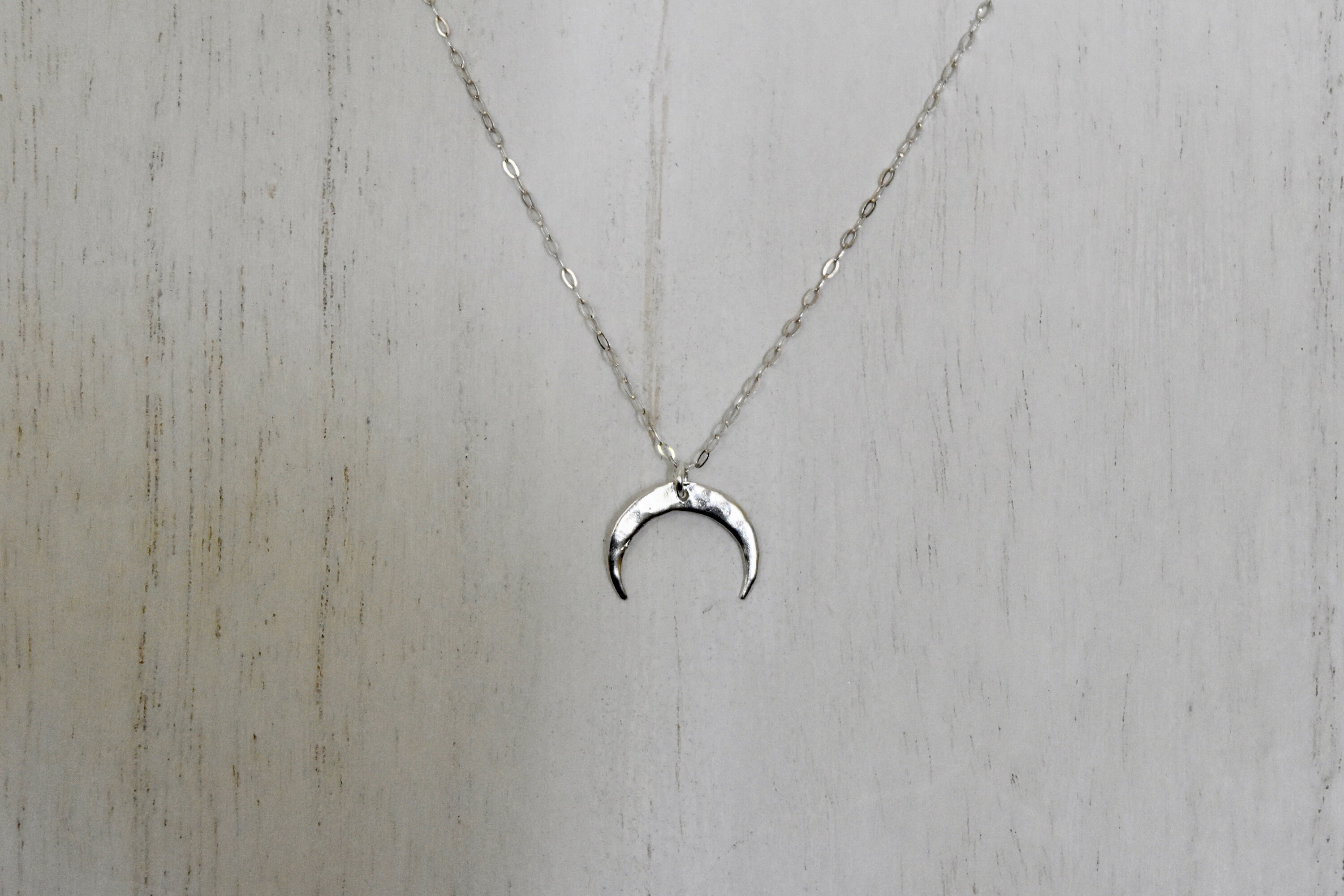 Silver crescent moon necklace // silver hammered moon necklace | Etsy