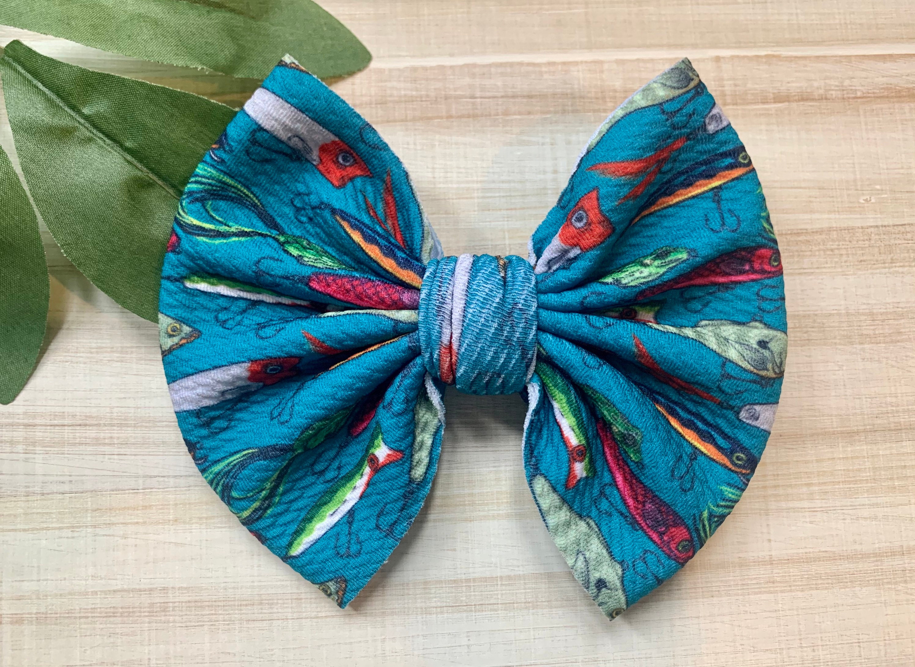 Teal bow with assorted fishing lures | Etsy