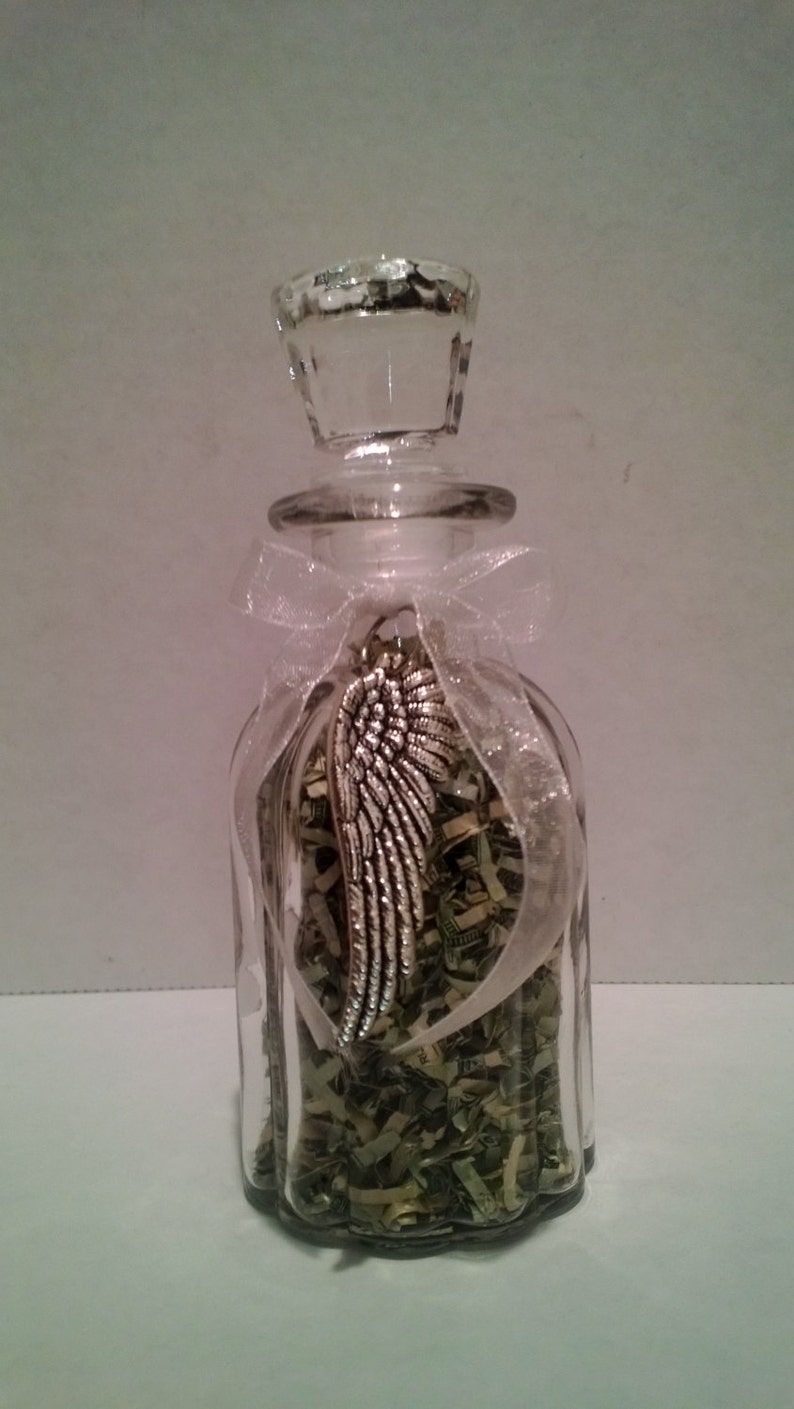 Beautiful Money Filled Angel Wing Bottle. Filled With Shredded Expired ...