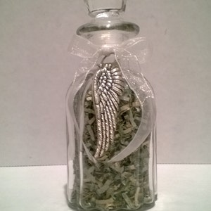 Beautiful Money Filled Angel Wing Bottle. Filled With Shredded Expired ...