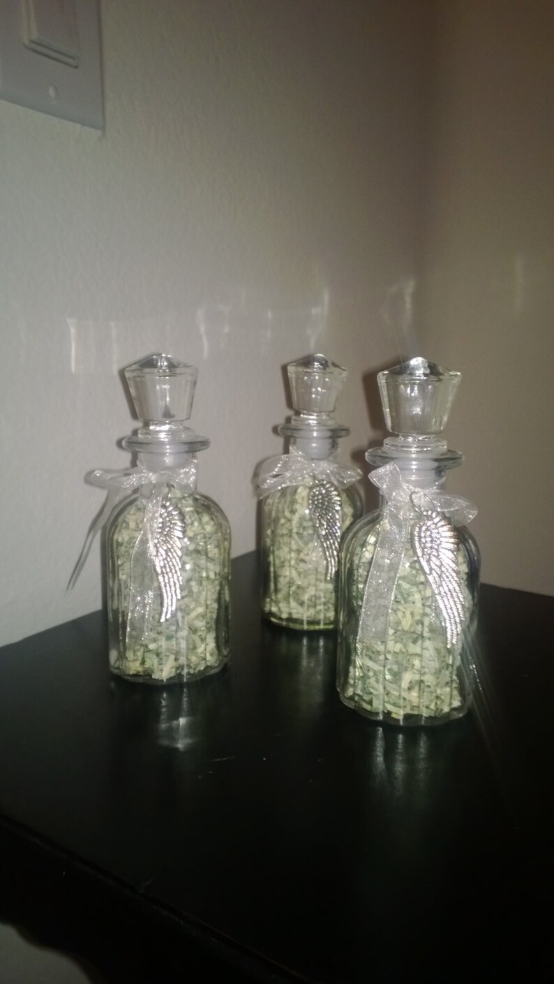 Beautiful Money Filled Angel Wing Bottle. Filled With Shredded Expired ...