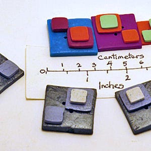 Buttons. Square Buttons With Unique, Bright Designs. Raised Designs ...