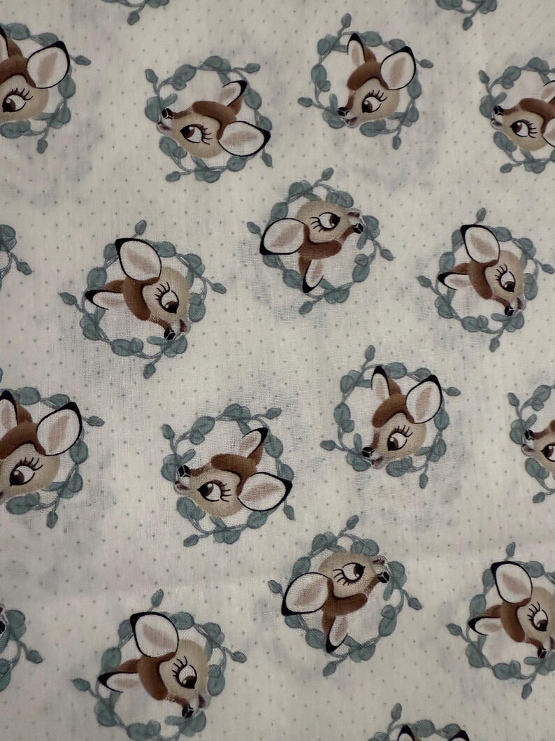 Disney’s Bambi -bambi Badge on a White Background With Small Teal Dots ...