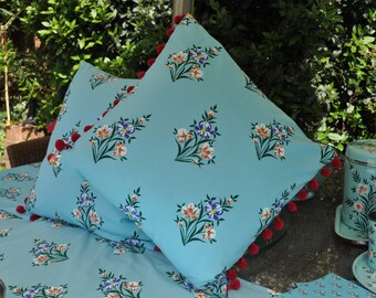 Bright Red floral splash cushion with pom poms | Etsy