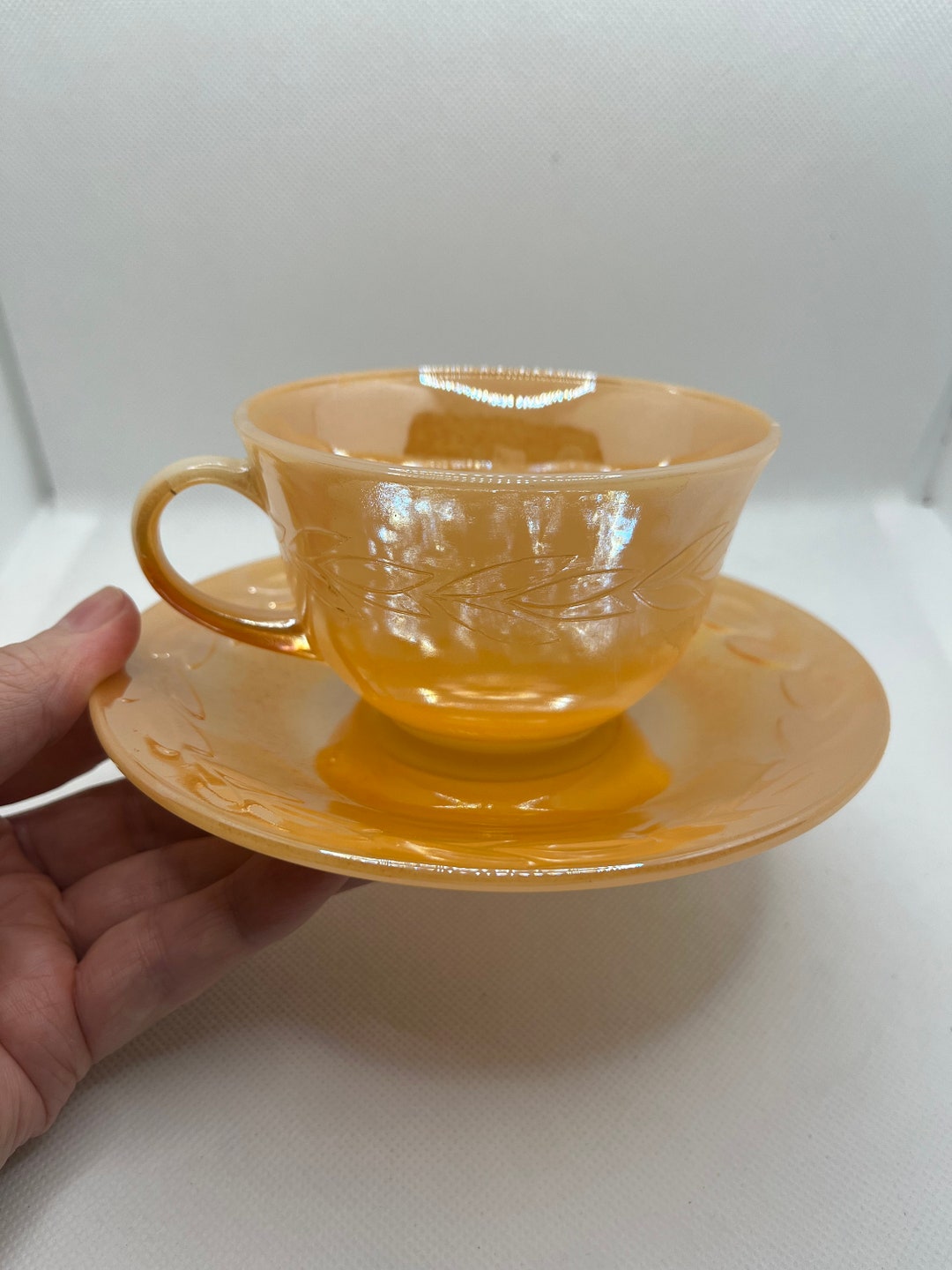 Fire King Marigold Peach Luster Ware Teacup and Saucer Orange W/ Laurel ...