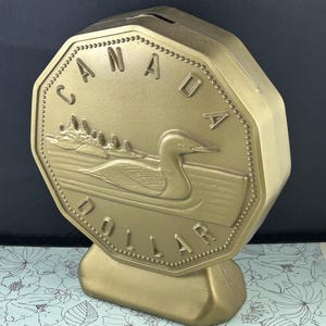 Vintage 1990’s Gold-coloured Plastic Canadian “loonie” Bank With ...