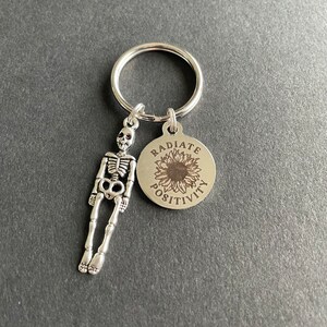 Radiate Positivity Keychain, Sunflower, Skeleton, Skull, Caduceus ...
