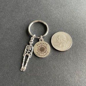 Radiate Positivity Keychain, Sunflower, Skeleton, Skull, Caduceus ...