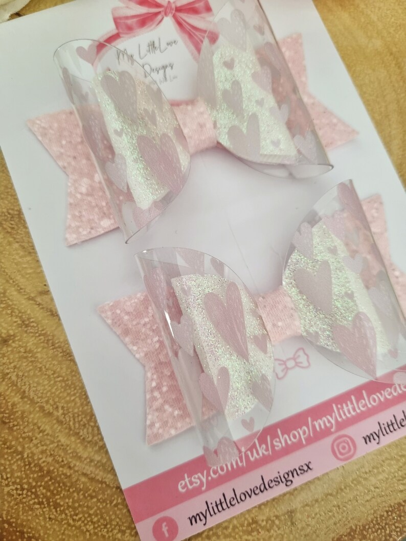 Lazo para el pelo con forma de corazón con purpurina rosa y blanca **SE ...