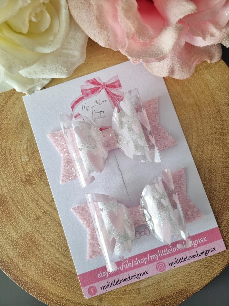 Lazo para el pelo con forma de corazón con purpurina rosa y blanca **SE ...