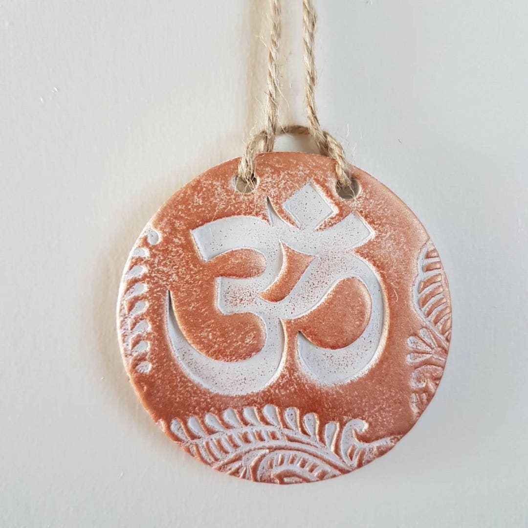 Metallic Coloured Om Clay Wall Decoration. White Clay With Copper Paint ...