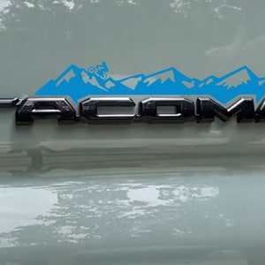 Mountains With Mountain Bike for 3rd Gen Tacoma Over Emblem Badge ...