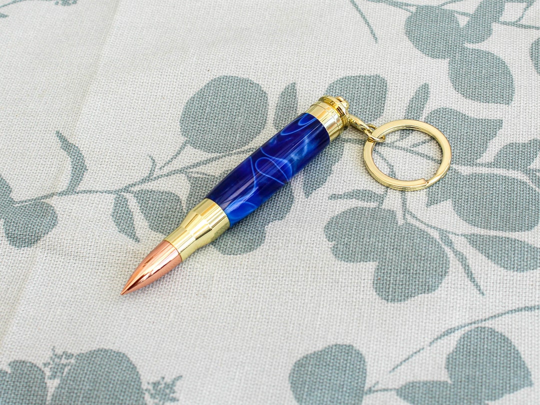 A Bullet Keyring Made From Swirl-pattern Blue Acrylic With Gold and ...