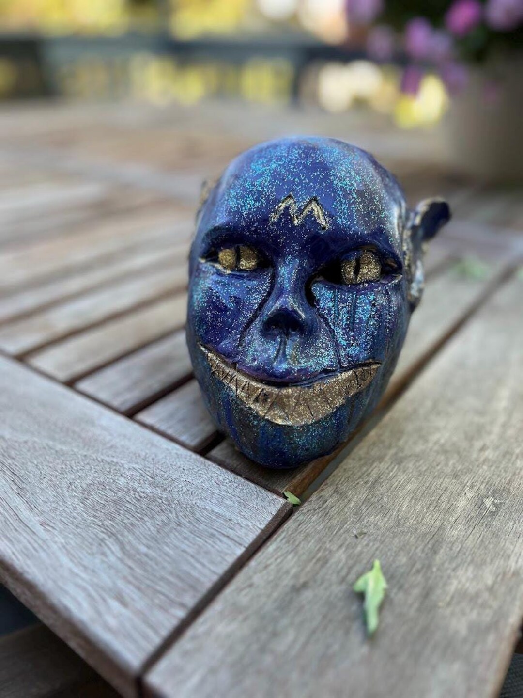 Tabletop Sized Gargoyle Head With a Large Grin in Blues With Yellow ...