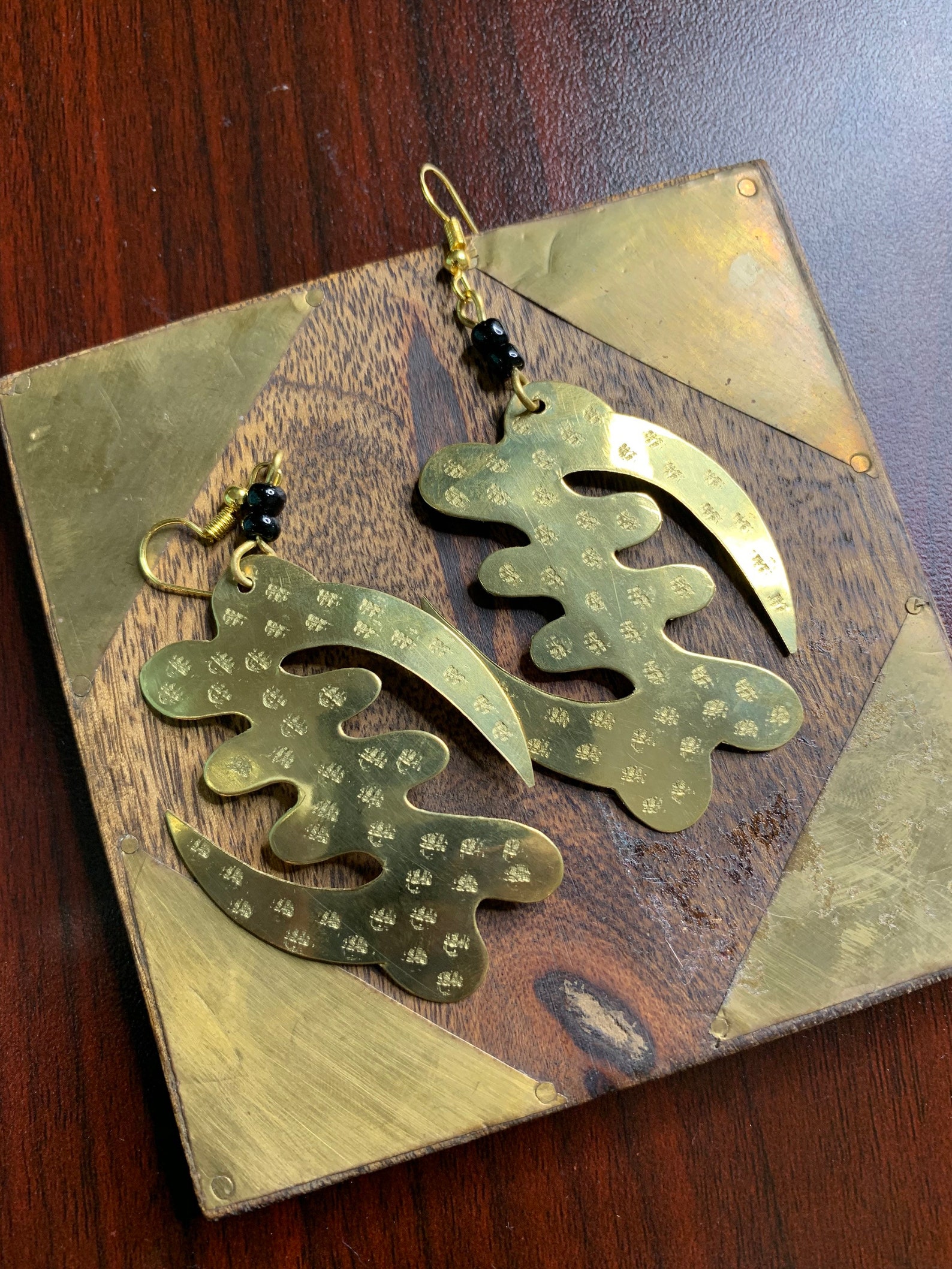 Bronze carved Dinka symbol earrings | Etsy