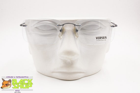VERSACE VERSUS C19 Rimless eyeglass frame, graphite c… - Gem