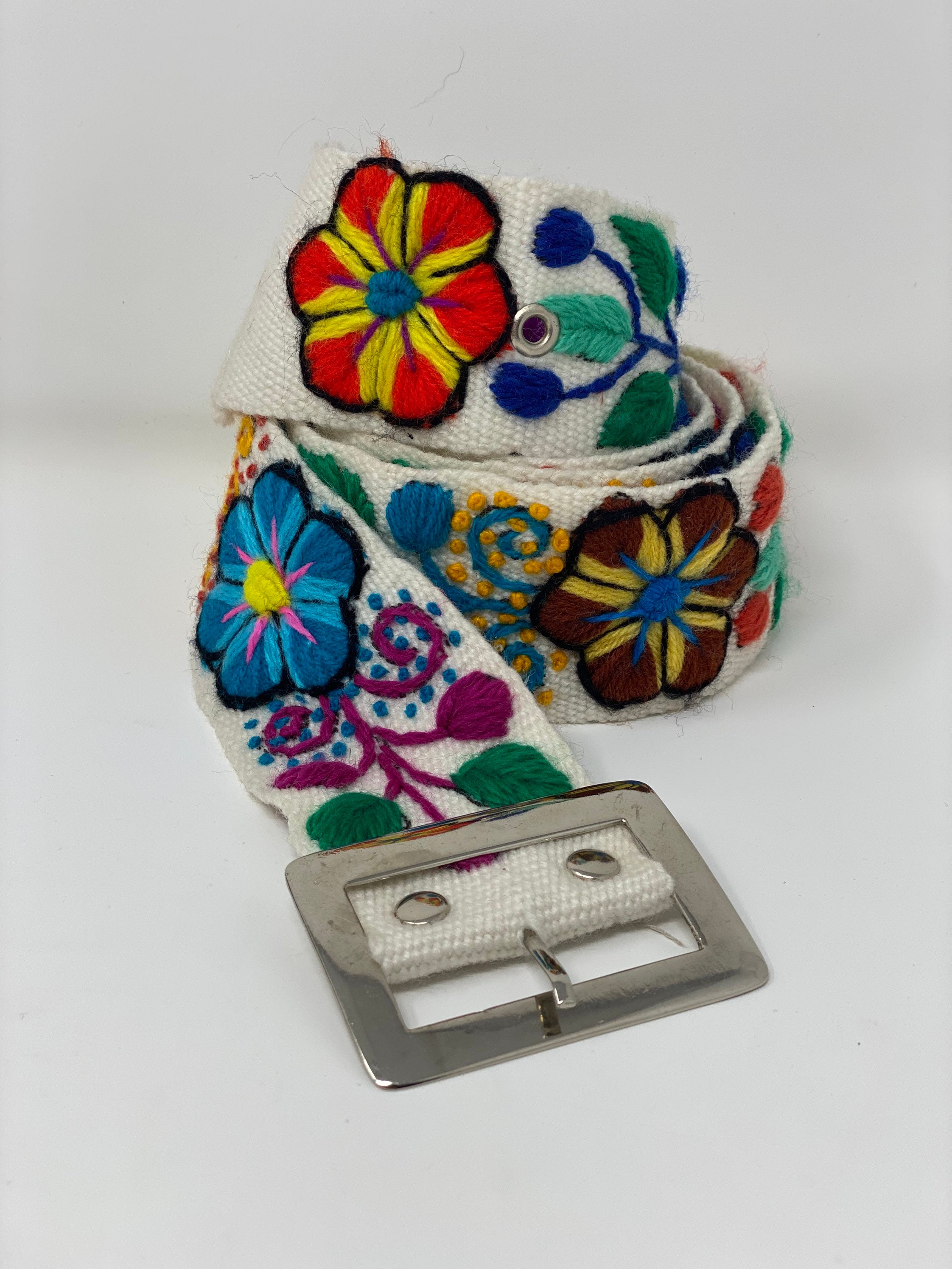 Hand embroidered wool belts from Peru
