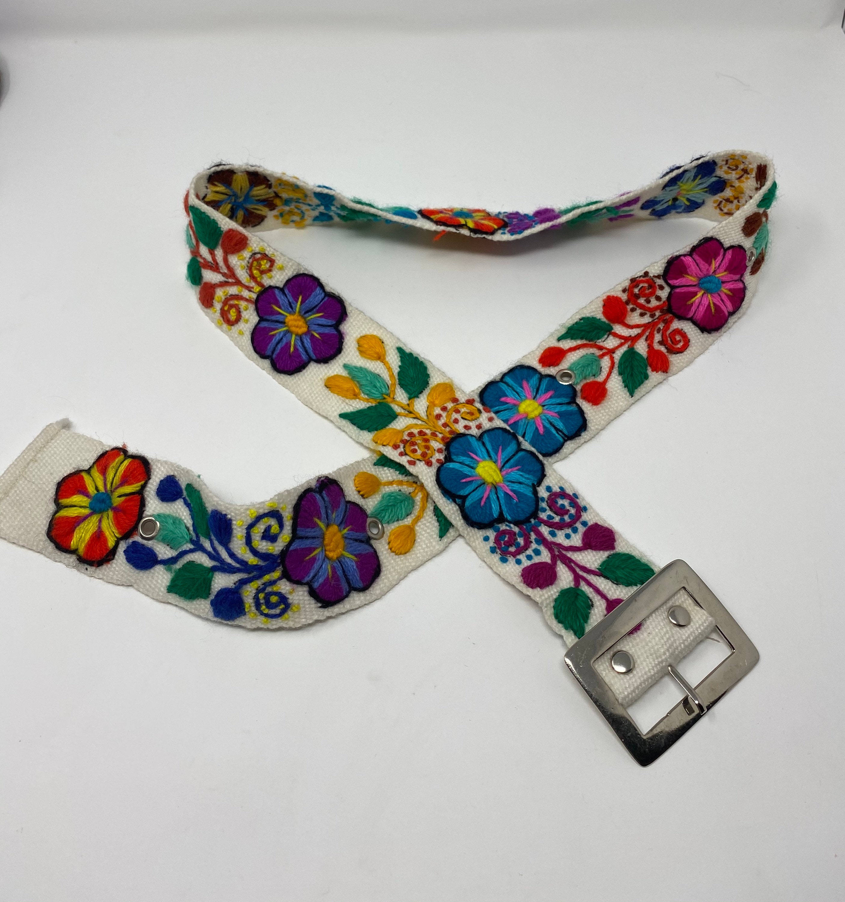 Hand embroidered wool belts from Peru