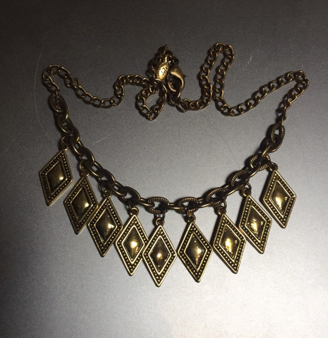 Collar con babero en tono dorado de Marie Chavez Collar de diseñador de ...