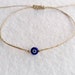 Gold string evil eye bracelet Blue evil eye hematite | Etsy