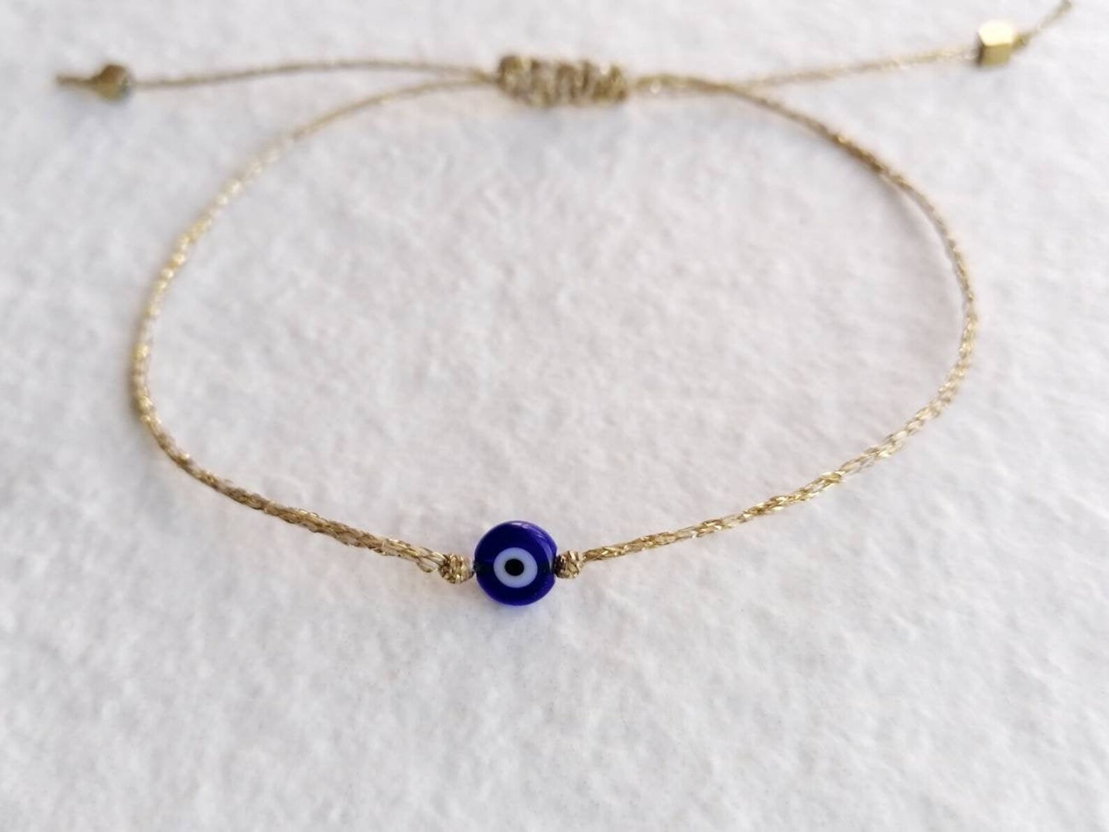 Gold string evil eye bracelet Blue evil eye hematite | Etsy