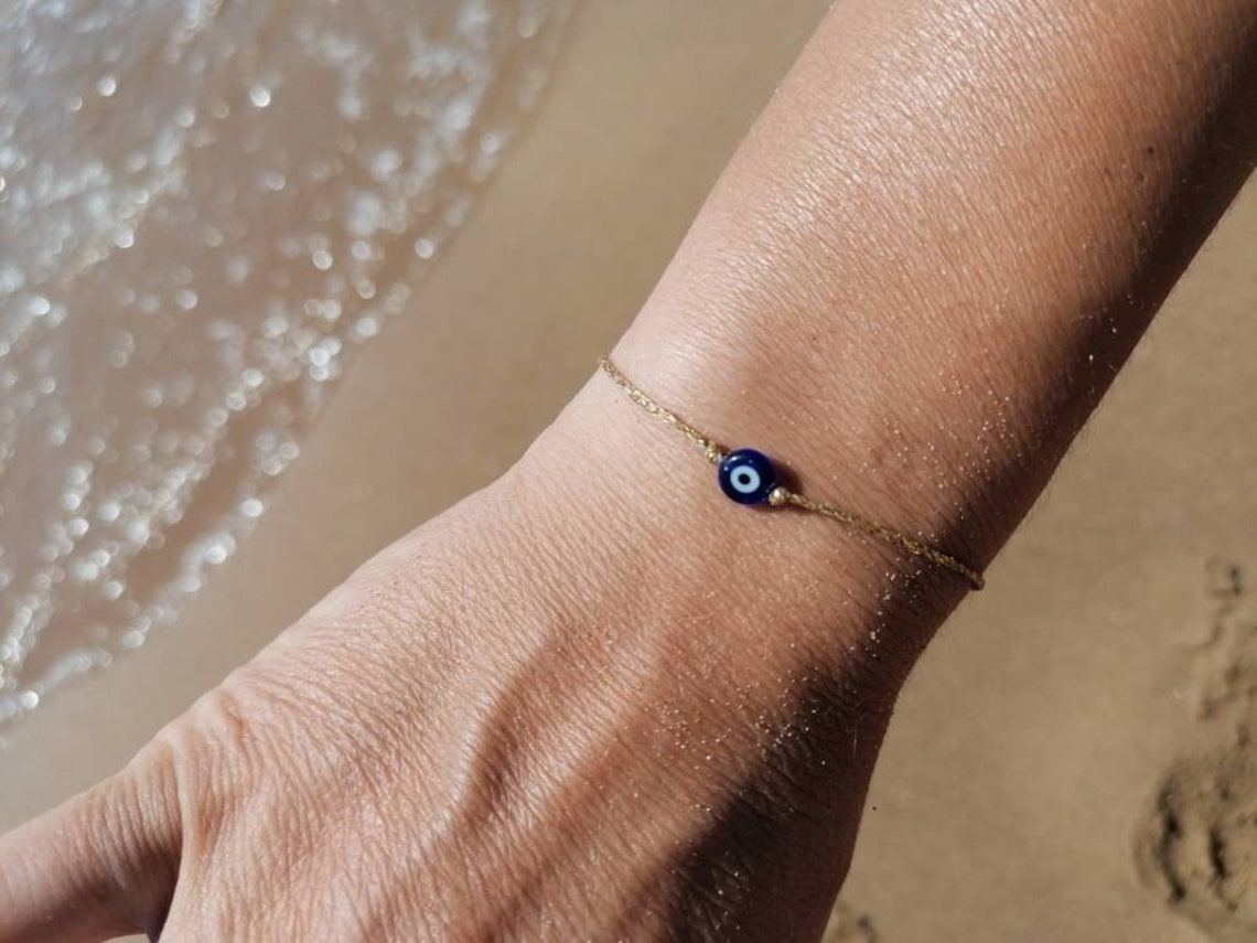 Gold string evil eye bracelet Blue evil eye hematite | Etsy