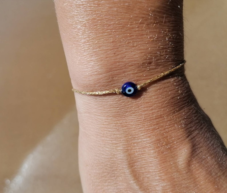 Gold string evil eye bracelet Blue evil eye hematite | Etsy