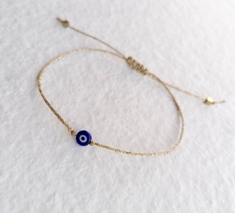 Gold string evil eye bracelet Blue evil eye hematite | Etsy