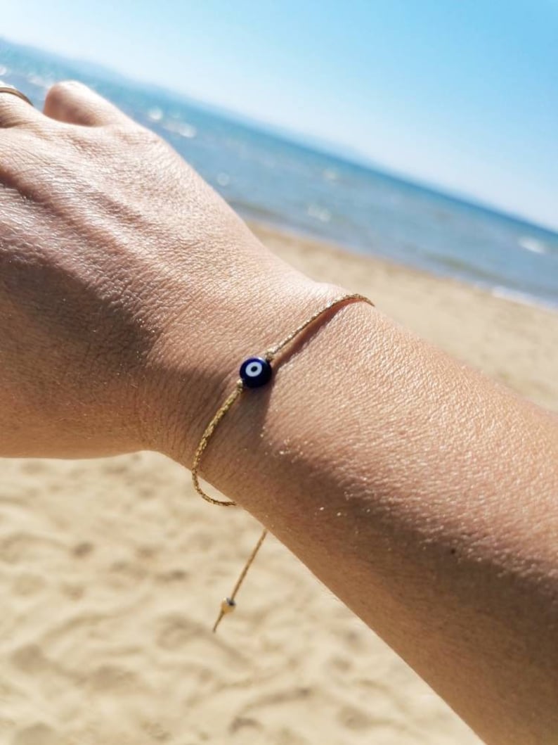 Gold string evil eye bracelet Blue evil eye hematite | Etsy