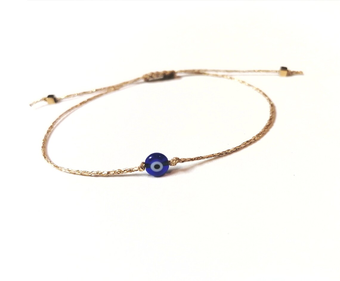 Gold string evil eye bracelet Blue evil eye hematite | Etsy