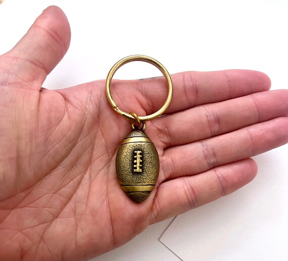 Gold/bronze-tone football sports fan keychain - Gem