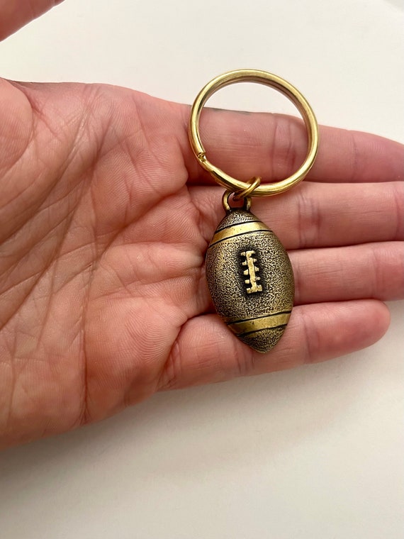Gold/bronze-tone football sports fan keychain - Gem
